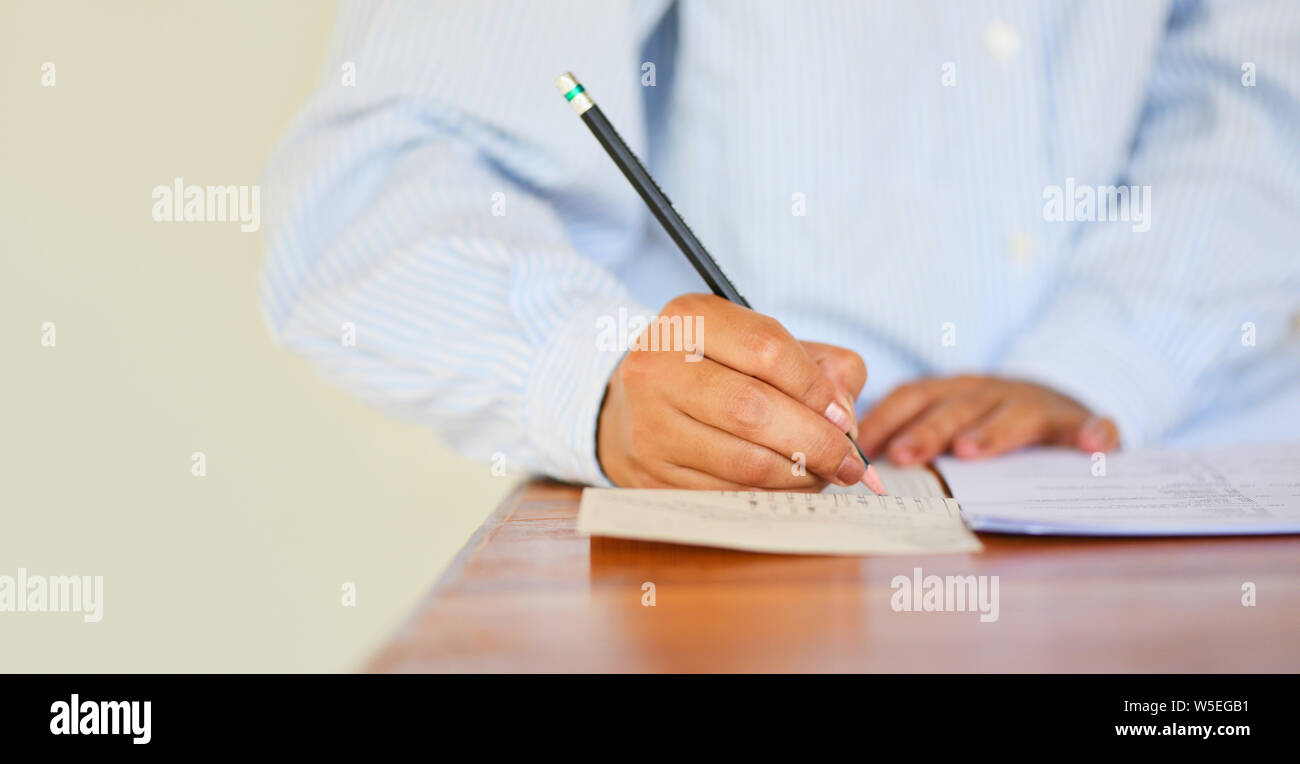 take the exam final high school university student holding pencil ...