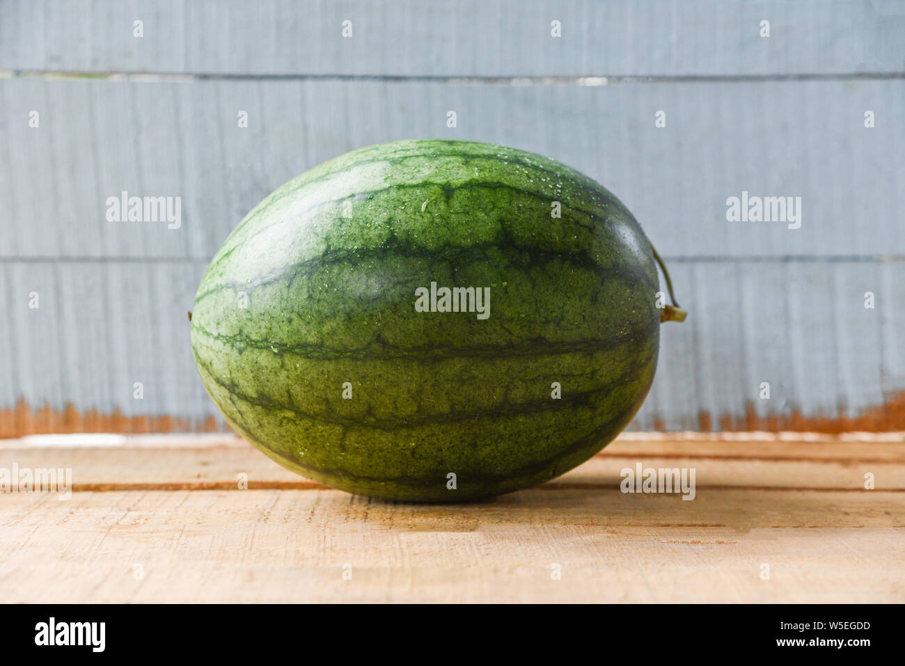 Watermelon summer fruit fresh on wooden background Stock Photo - Alamy