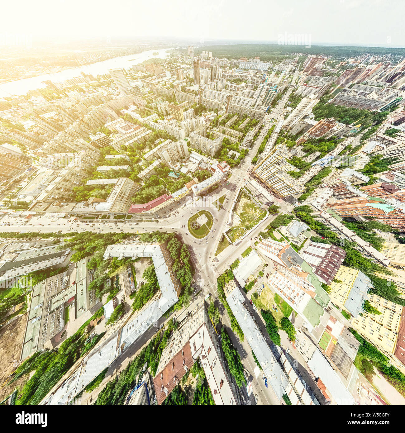 Aerial city view with crossroads and roads, houses, buildings, parks ...