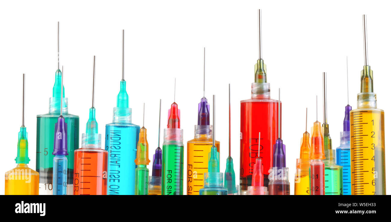 Collection of bright and colorful syringes Stock Photo - Alamy