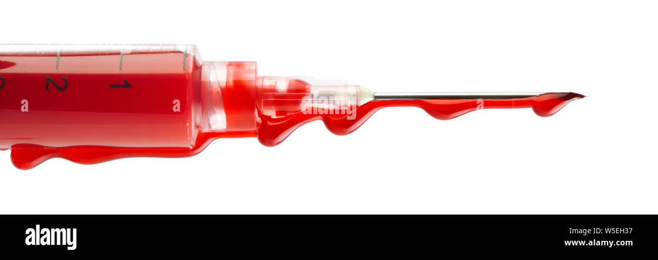 Syringe filled with blood and dripping from the needle - isolated on ...