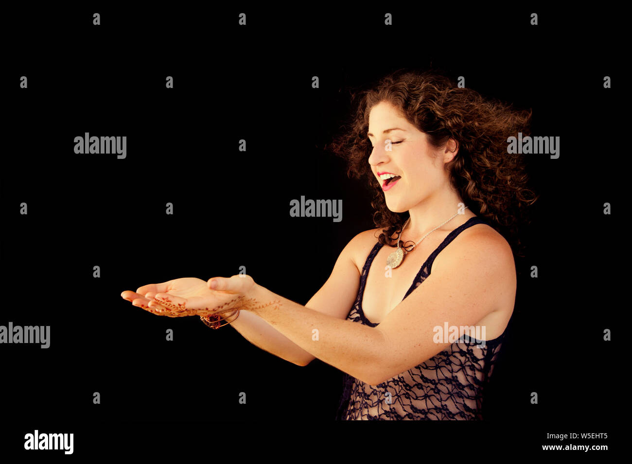 Woman receiving with joyful energy Stock Photo - Alamy