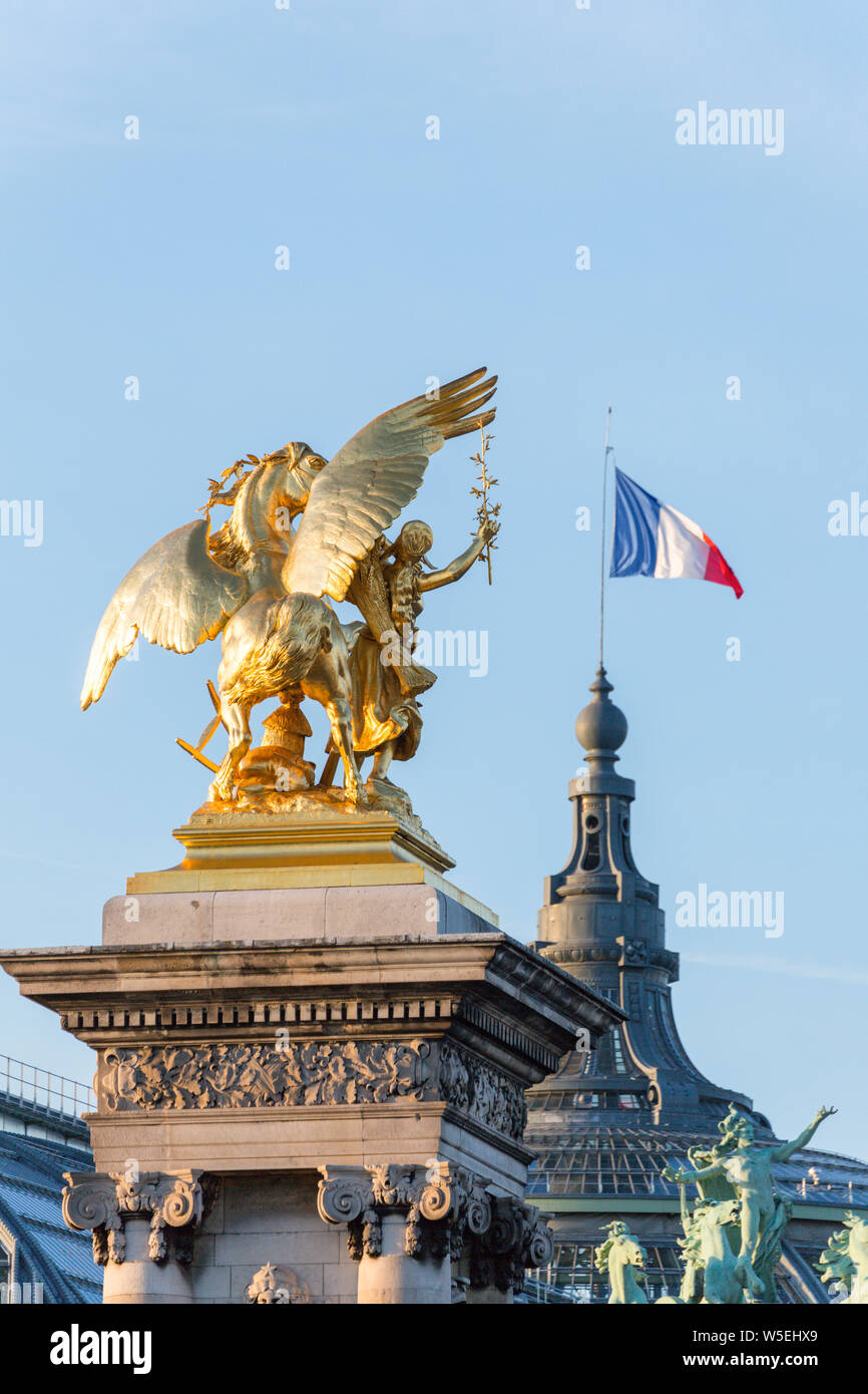 Gilded statue on Pont Alexandre III, Grand Palais behind, Paris, France ...