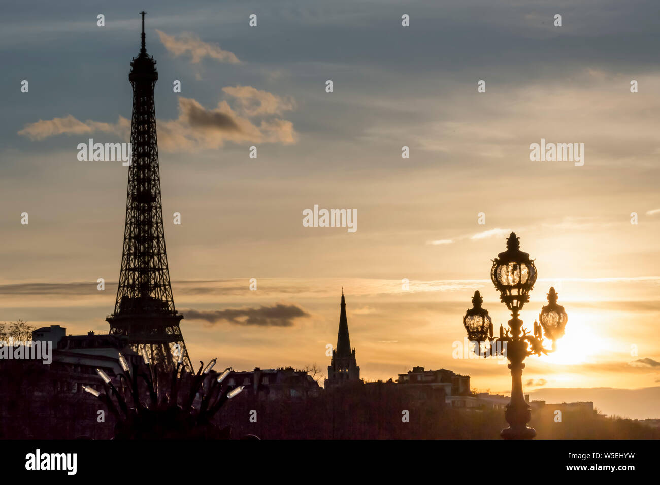 Eiffel Tower with dramatic sunset at Pont Alexandre III Stock Photo - Alamy