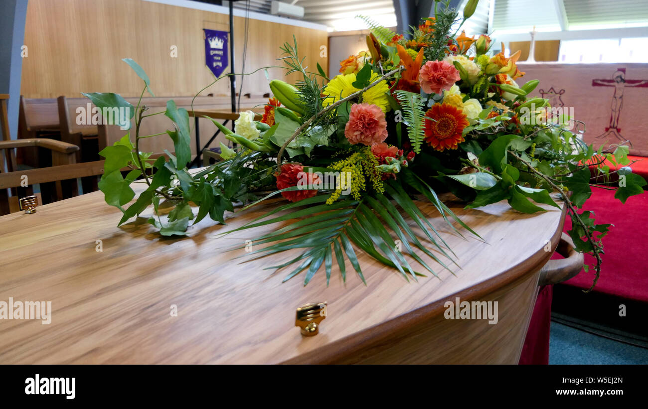 closeup shot of a funeral casket in a hearse or chapel or burial at ...