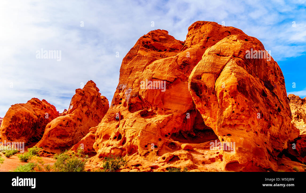 Sunrise over the bright red Aztec sandstone rock formation of the Seven ...