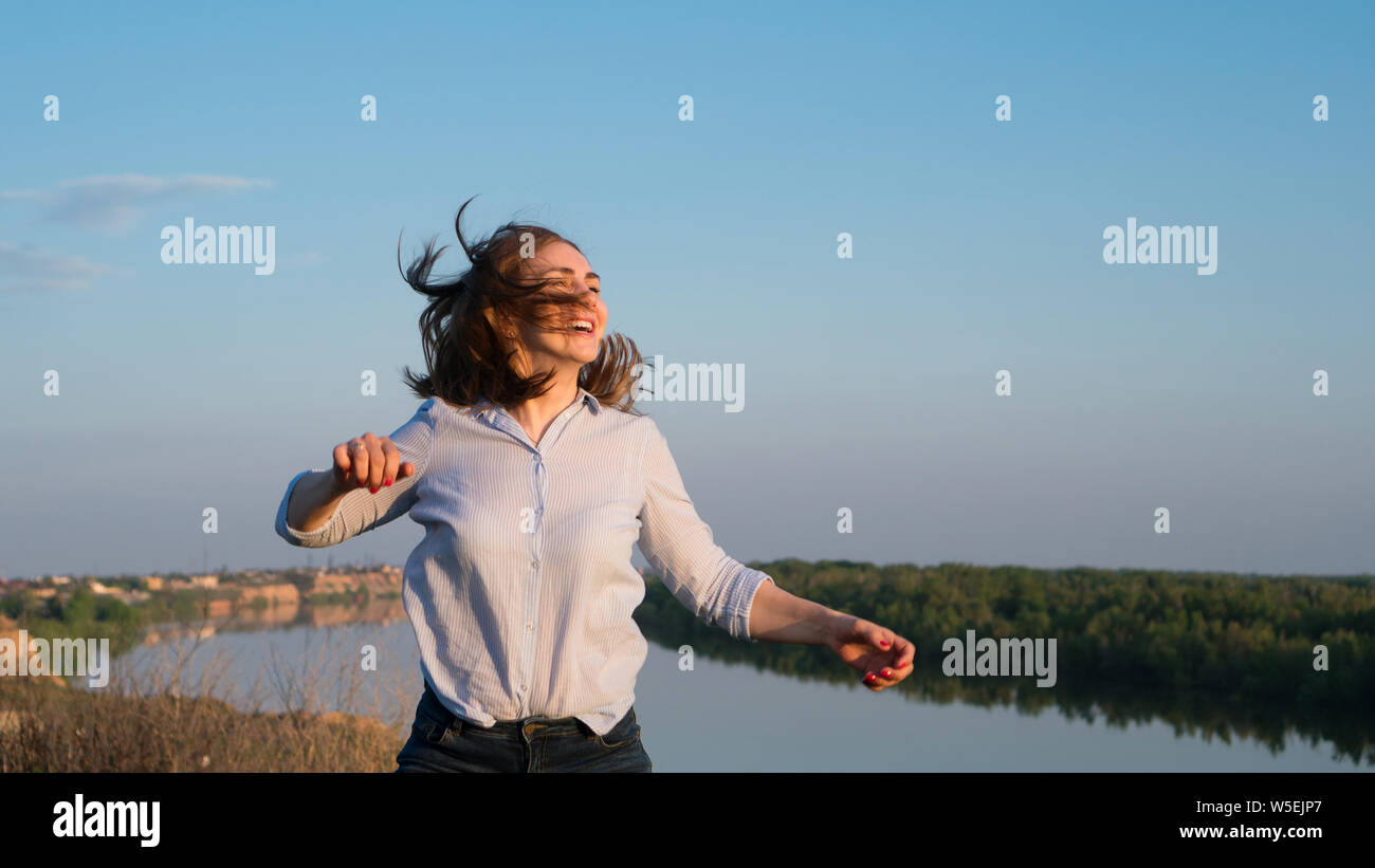 Jocund brown-haired woman dancing on the street. Portrait of emotional ...