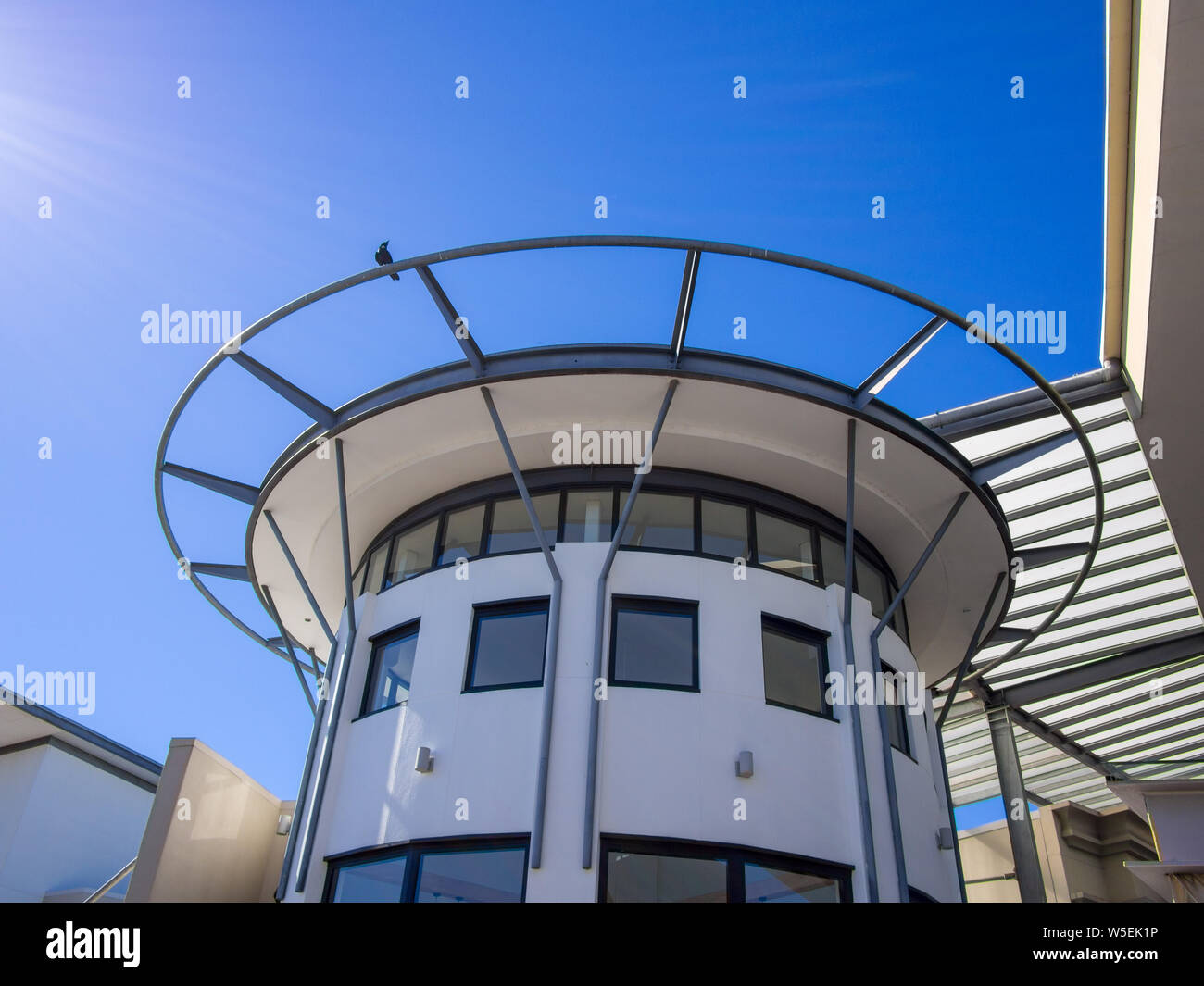 Round shaped modern building against the blue sky Stock Photo - Alamy