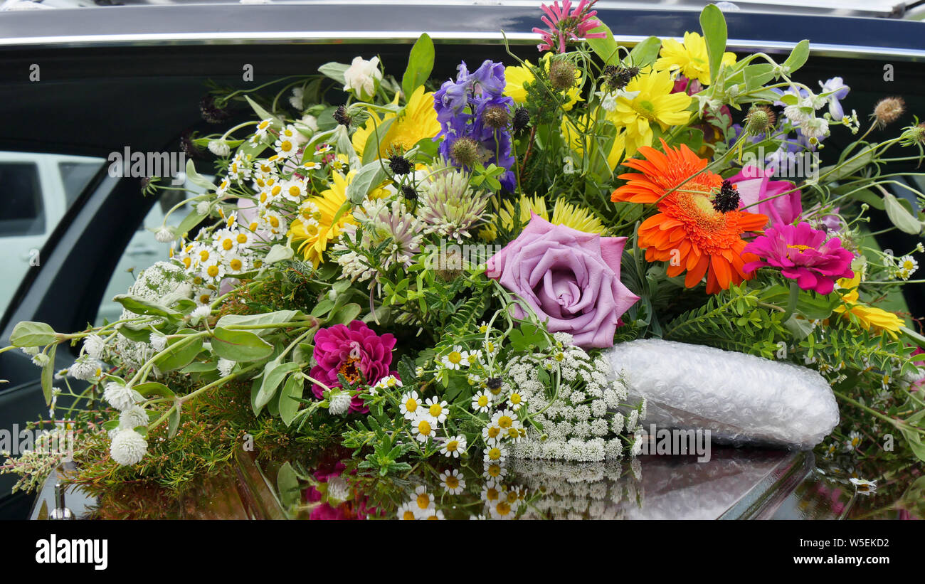 closeup shot of a funeral casket in a hearse or chapel or burial at ...