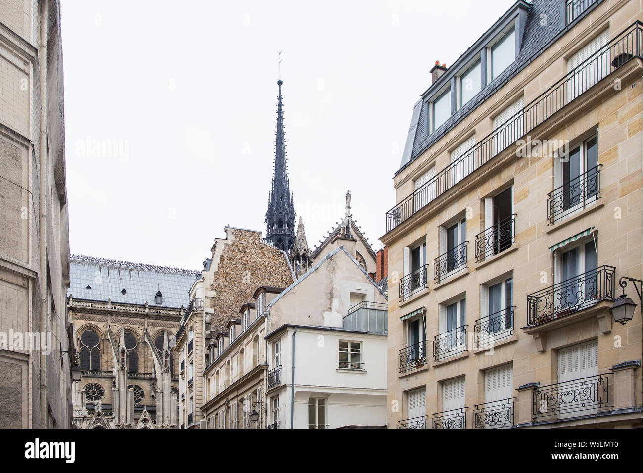 Notre Dame Cathedral on Ile de la Cite from street level with apartment ...