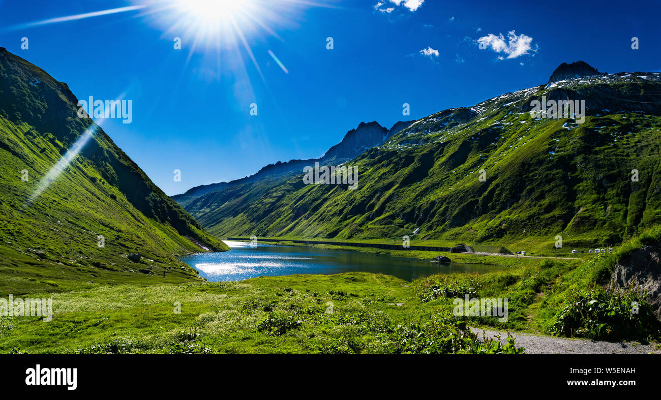Switzerland Green Mountainside During the Summer with Sun Vignetting ...