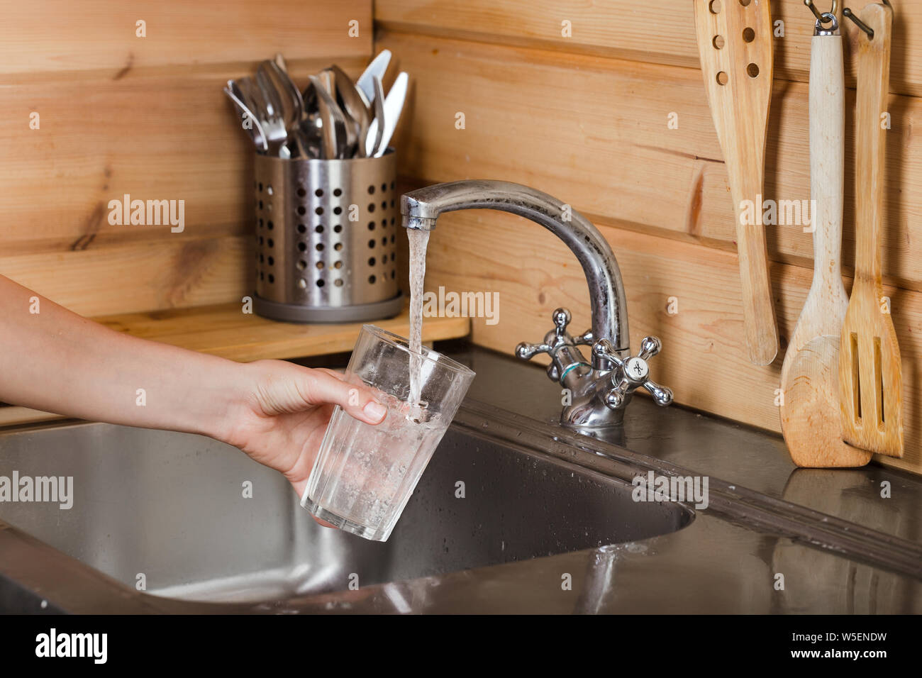 Hand girl water glass sink hi-res stock photography and images - Alamy