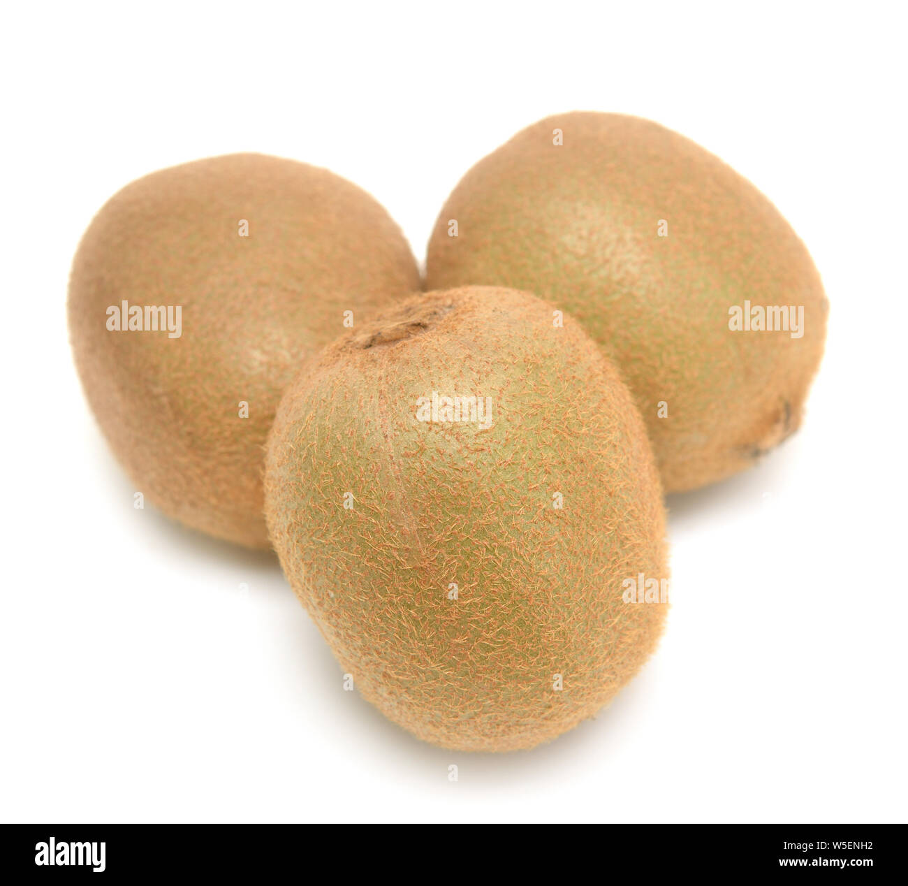three organic whole kiwi on white background Stock Photo - Alamy