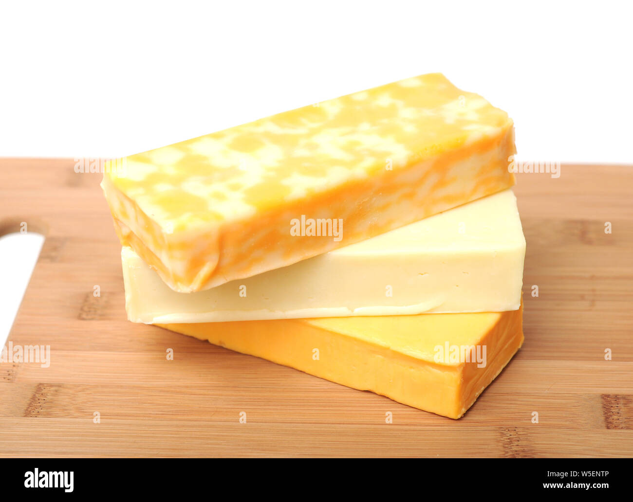 three Cheese bars on cutting board isolated on white Stock Photo - Alamy