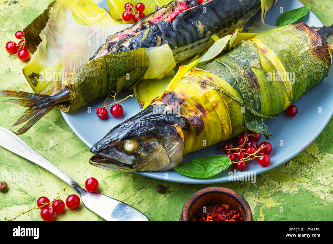 Baked mackerel stuffed with berries.Fish with currant filling.Seafood ...