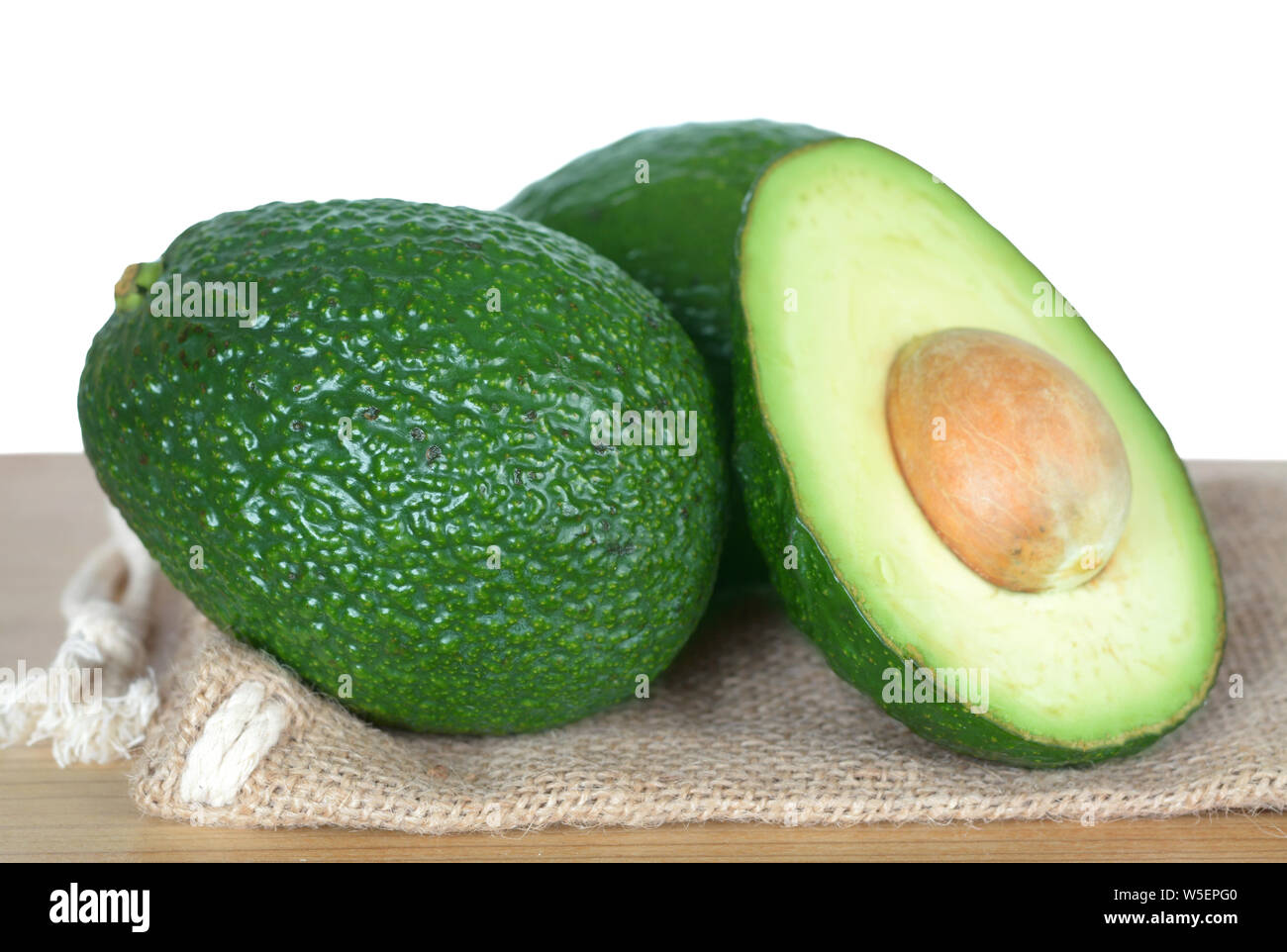 fresh full and section avocado showing at market place Stock Photo - Alamy