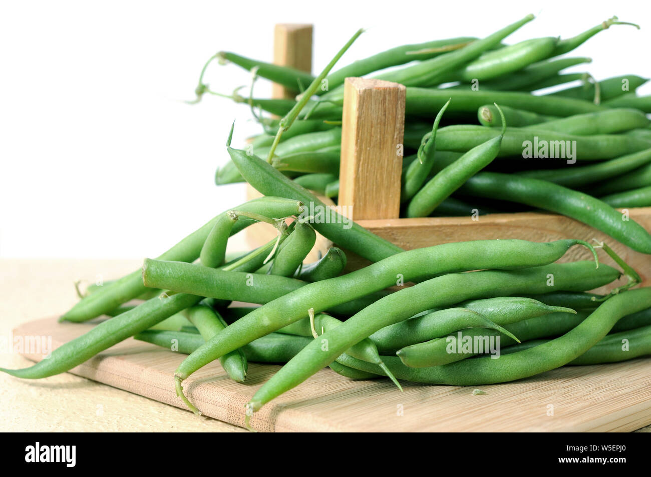 green bean with crate on cutting board Stock Photo - Alamy