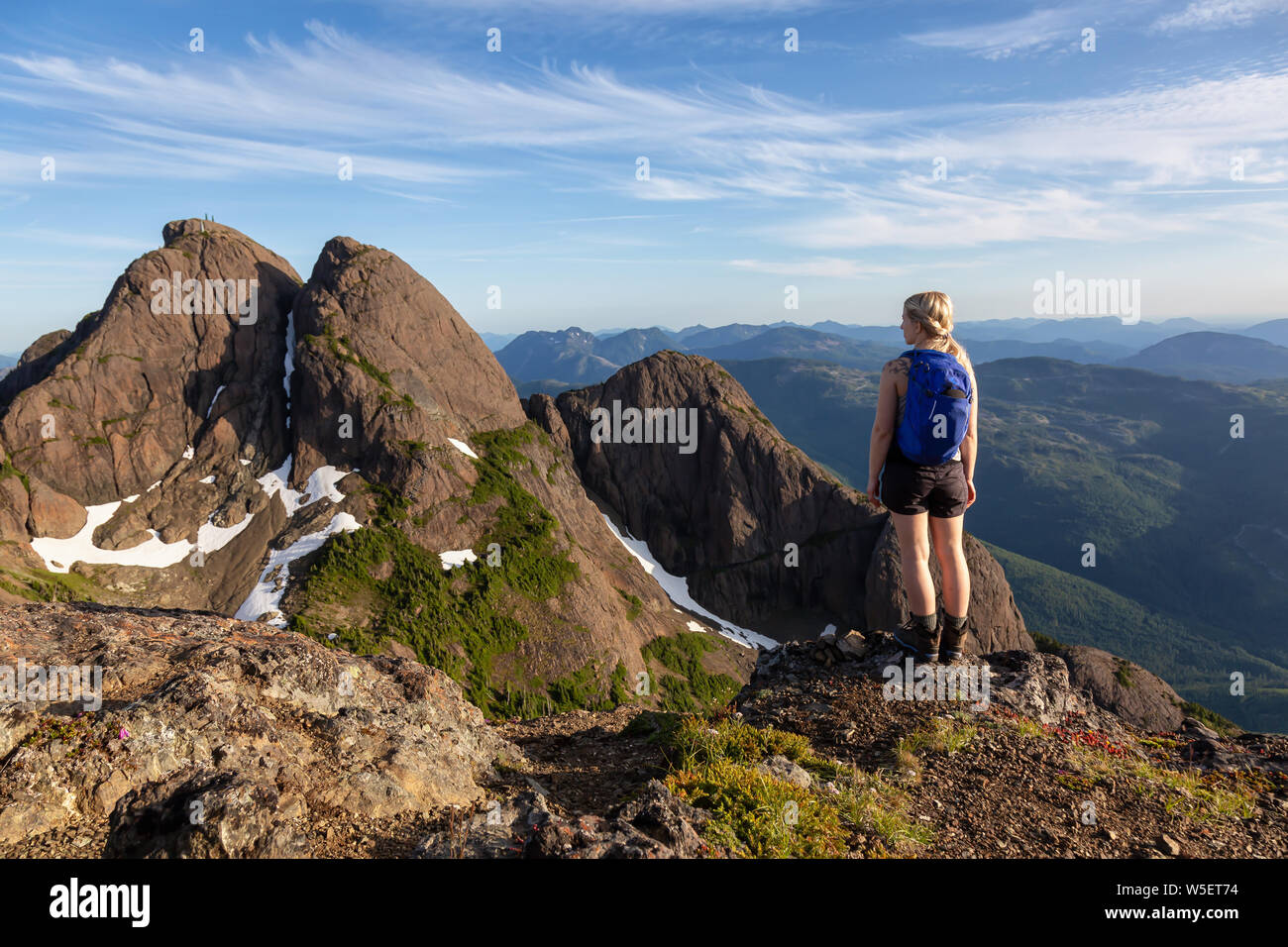 Adventurous girl hiking the beautiful trail in the Canadian Mountain ...
