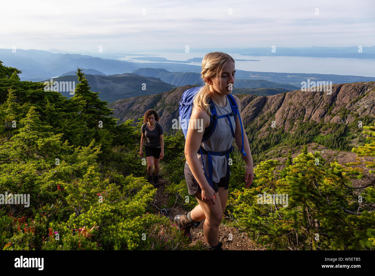 Adventurous girl hiking the beautiful trail in the Canadian Mountain ...