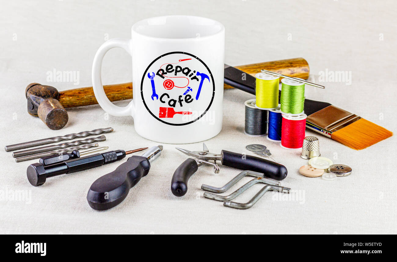 concept illustration, Repair Cafe logo on a cup surrounded by repair ...