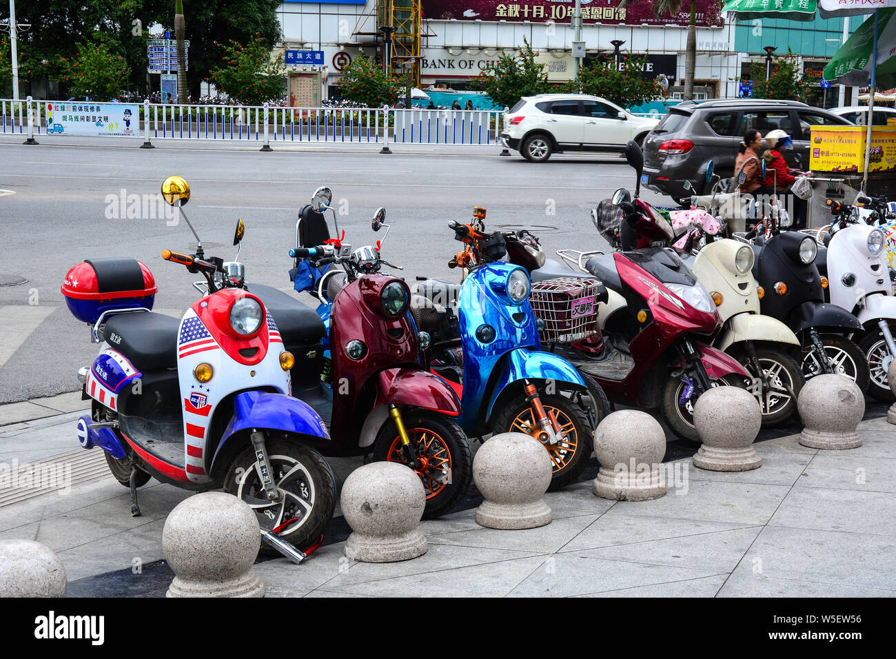 Nanning, China - Nov 1, 2015. Motorbikes parking on street in Nanning ...
