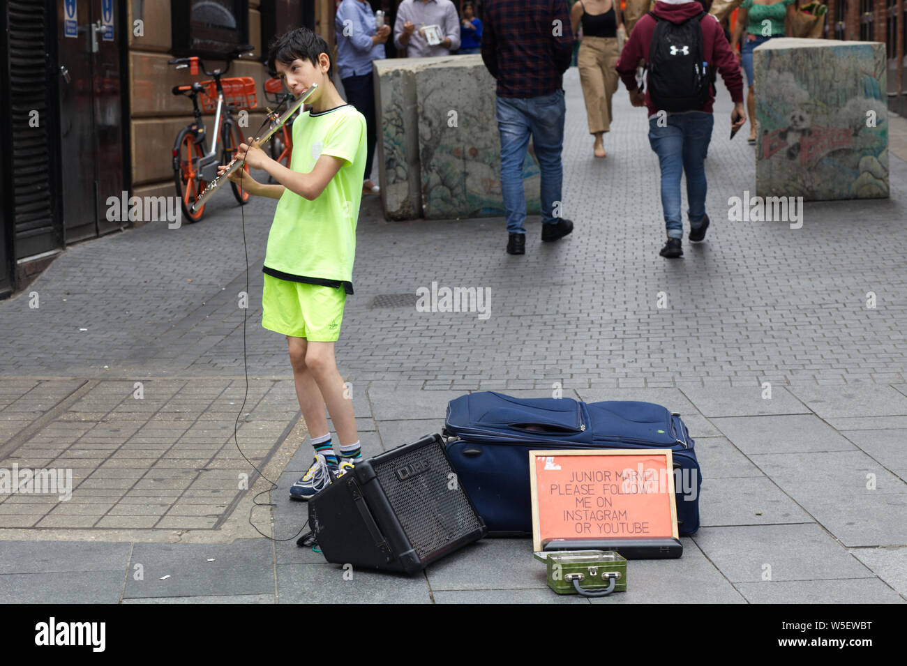 Child busker playing a flute hi-res stock photography and images - Alamy