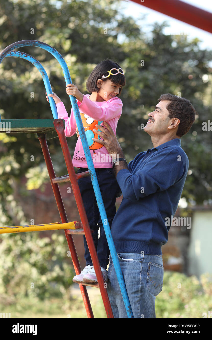 Child Climbing Up Slide High Resolution Stock Photography and Images ...