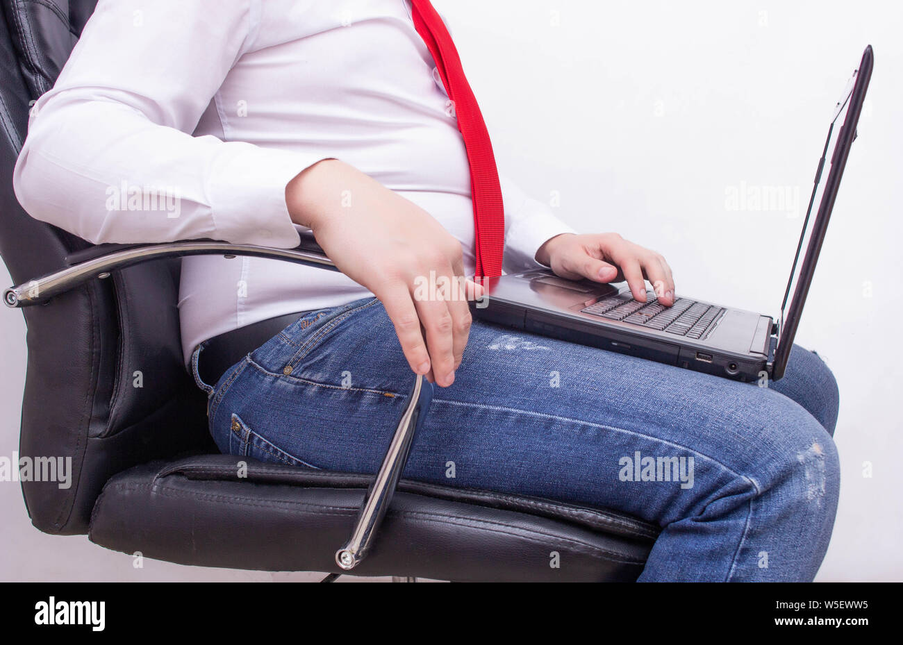 Office worker businessman with a laptop sitting on an office chair with ...