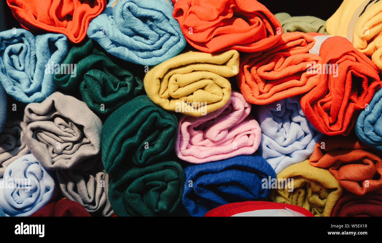Colorful textile for sale at a street market in Fenghuang Ancient Town ...