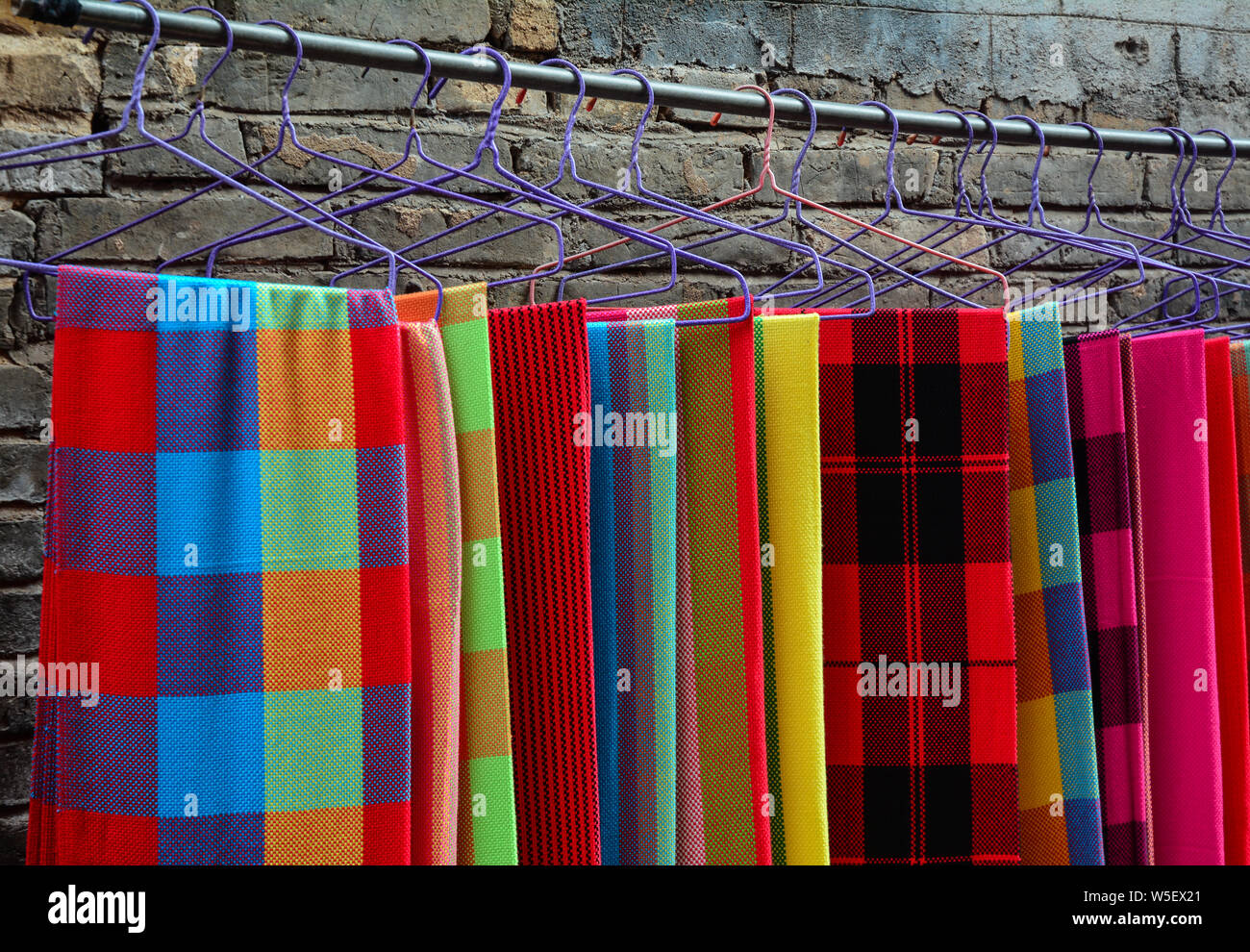 Colorful textile for sale at a street market in Fenghuang Ancient Town ...