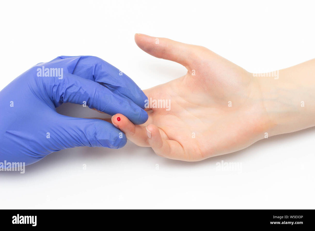 A doctor makes a general blood test to a female patient for a study of ...