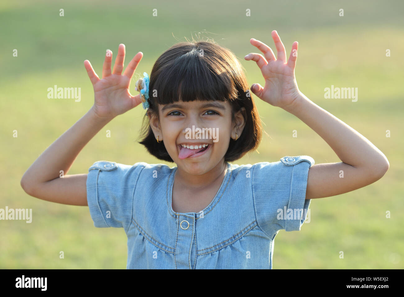 Portrait of a girl making a funny face Stock Photo - Alamy