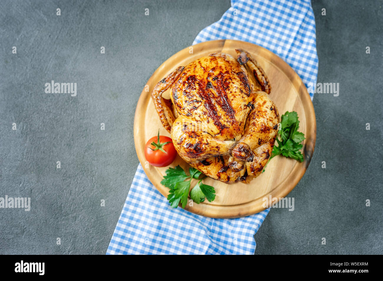 Roasted chicken on the grey rustic background Stock Photo - Alamy