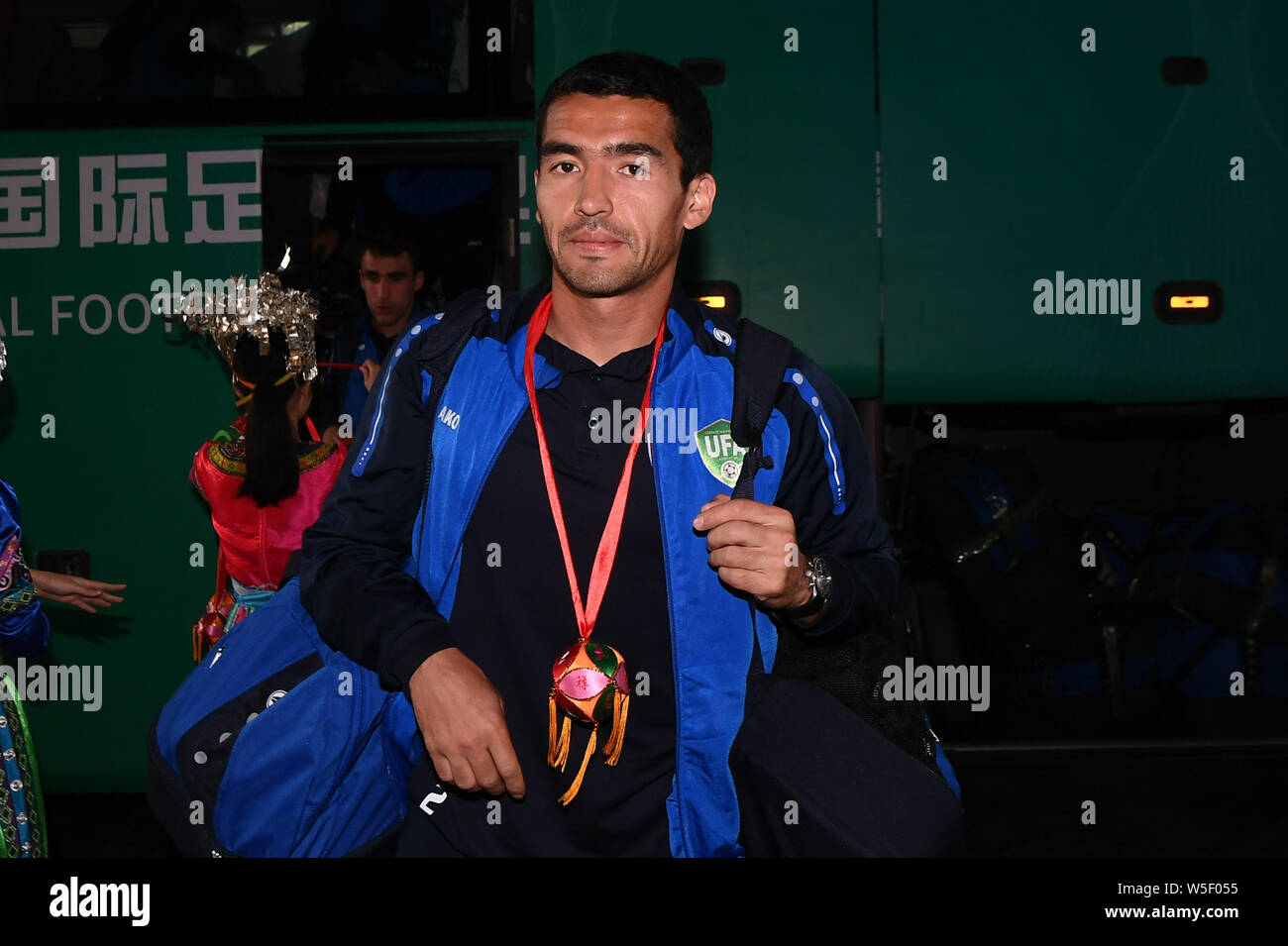 Players of Uzbekistan national men's football team arrive at a hotel ...