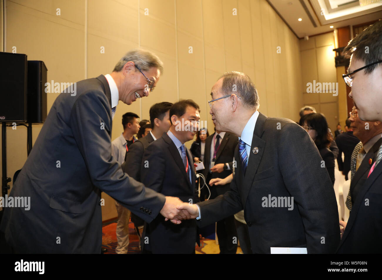 Kim Doh-yeon, left, President of Pohang University of Science and Technology, shakes hands with ...