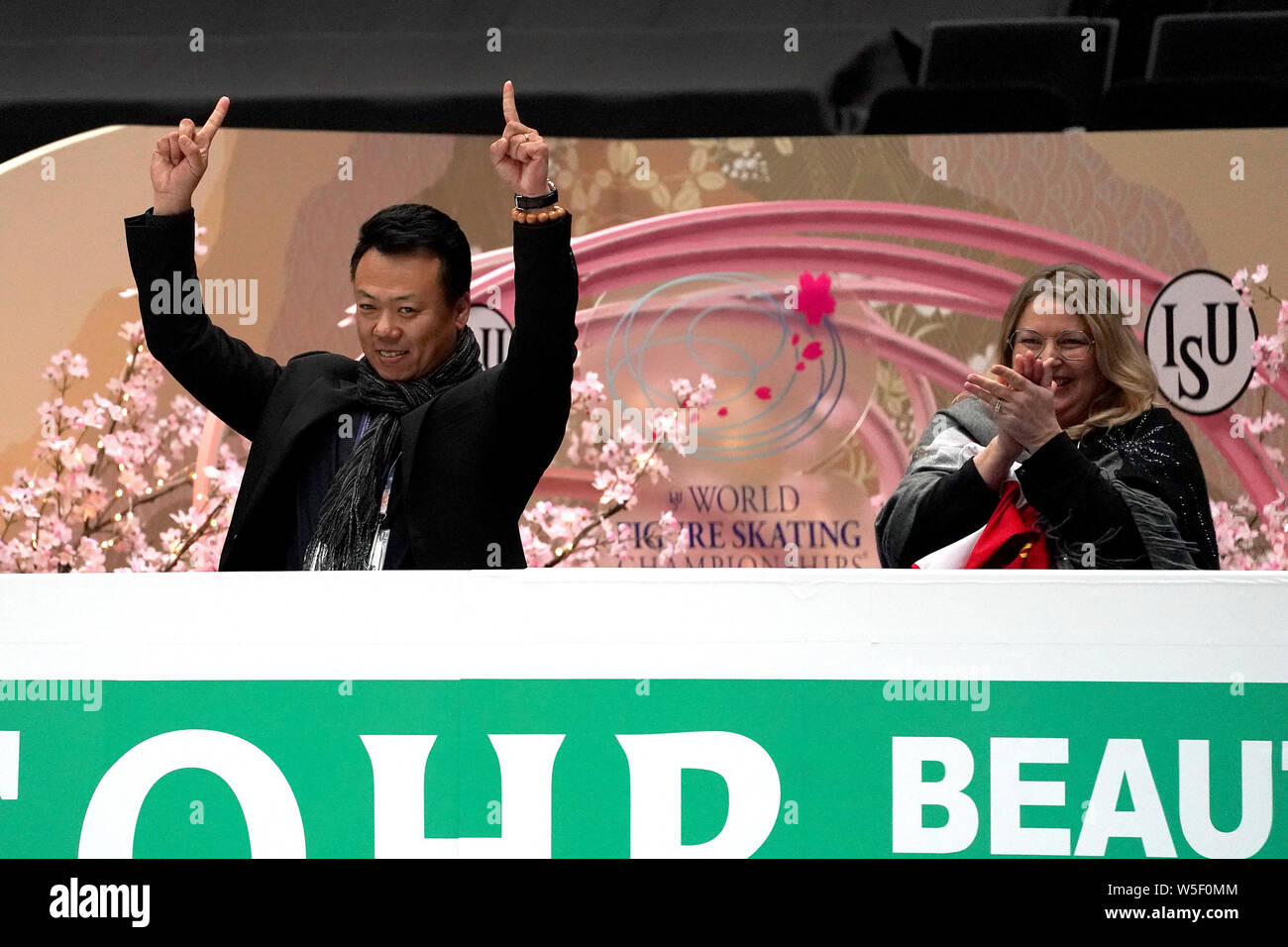 China's figure skating general coach Zhao Hongbo celebrates after his ...