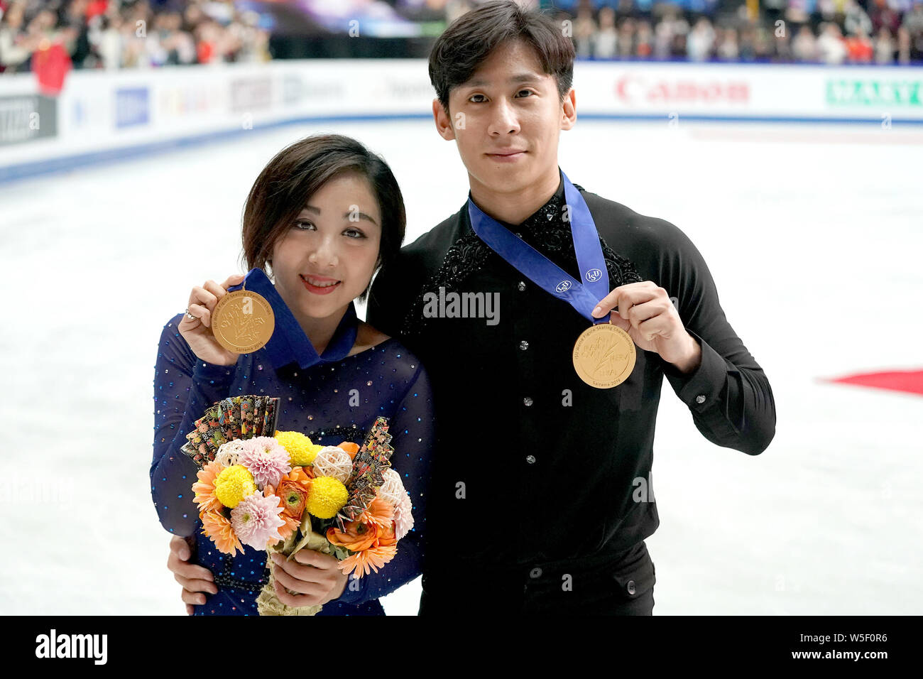 Gold medalists China's figure skaters Sui Wenjing and Han Cong pose ...