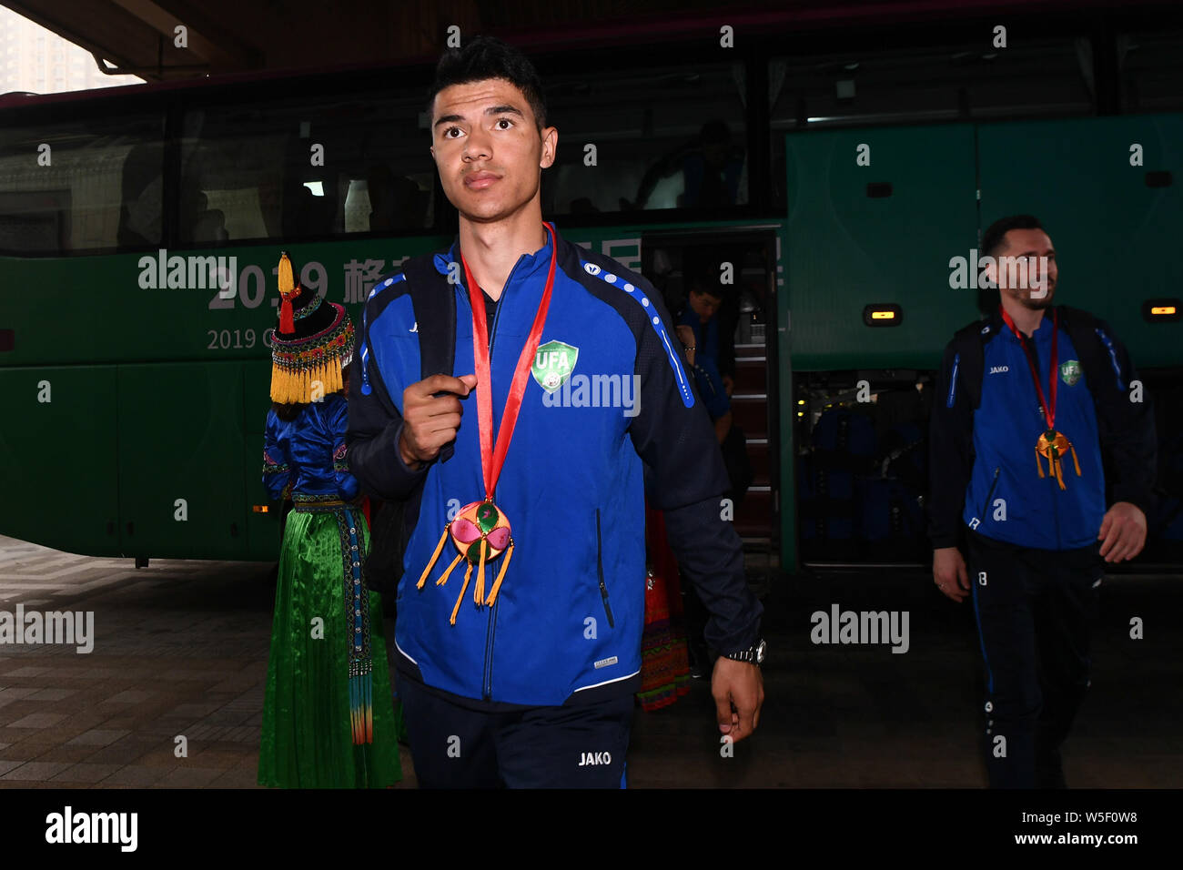 Players of Uzbekistan national men's football team arrive at a hotel ...