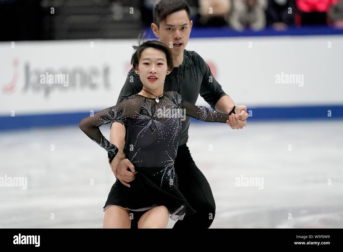 Chinese figure skaters Peng Cheng and Jin Yang compete in the Pairs ...