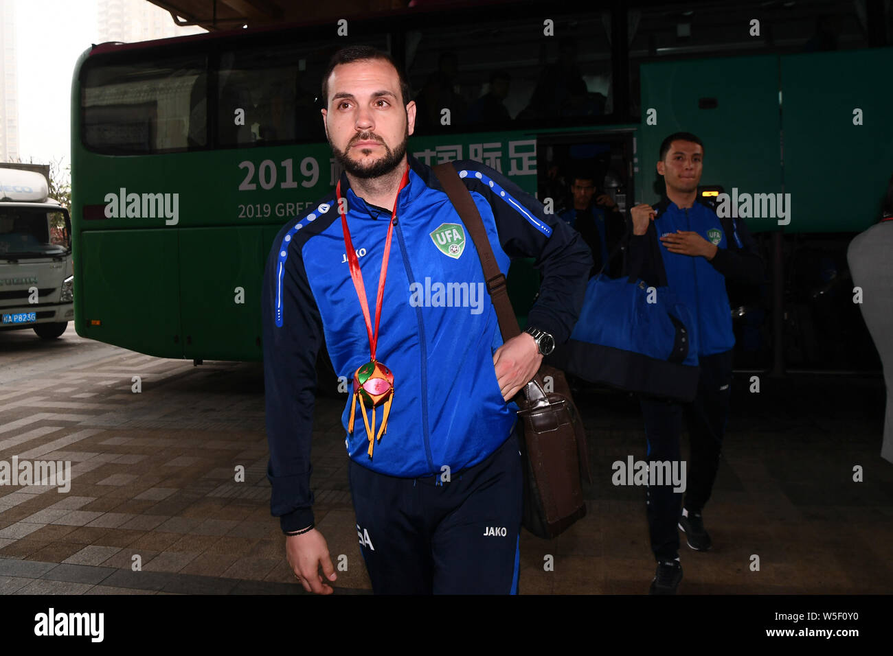 Players of Uzbekistan national men's football team arrive at a hotel ...