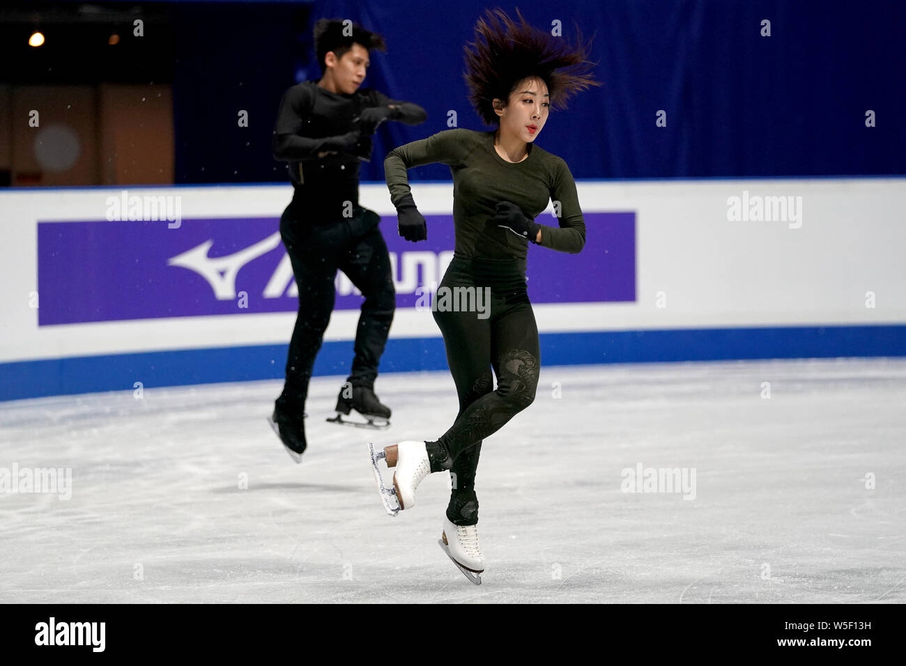 Chinese pair skaters Sui Wenjing and Han Cong take part in a training ...