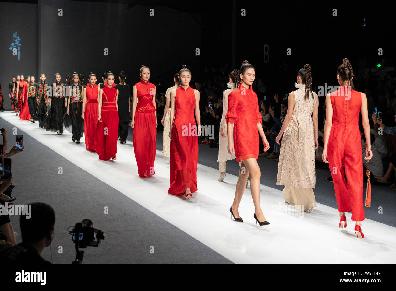 Models display new traditional costumes at the Sunshine fashion show ...