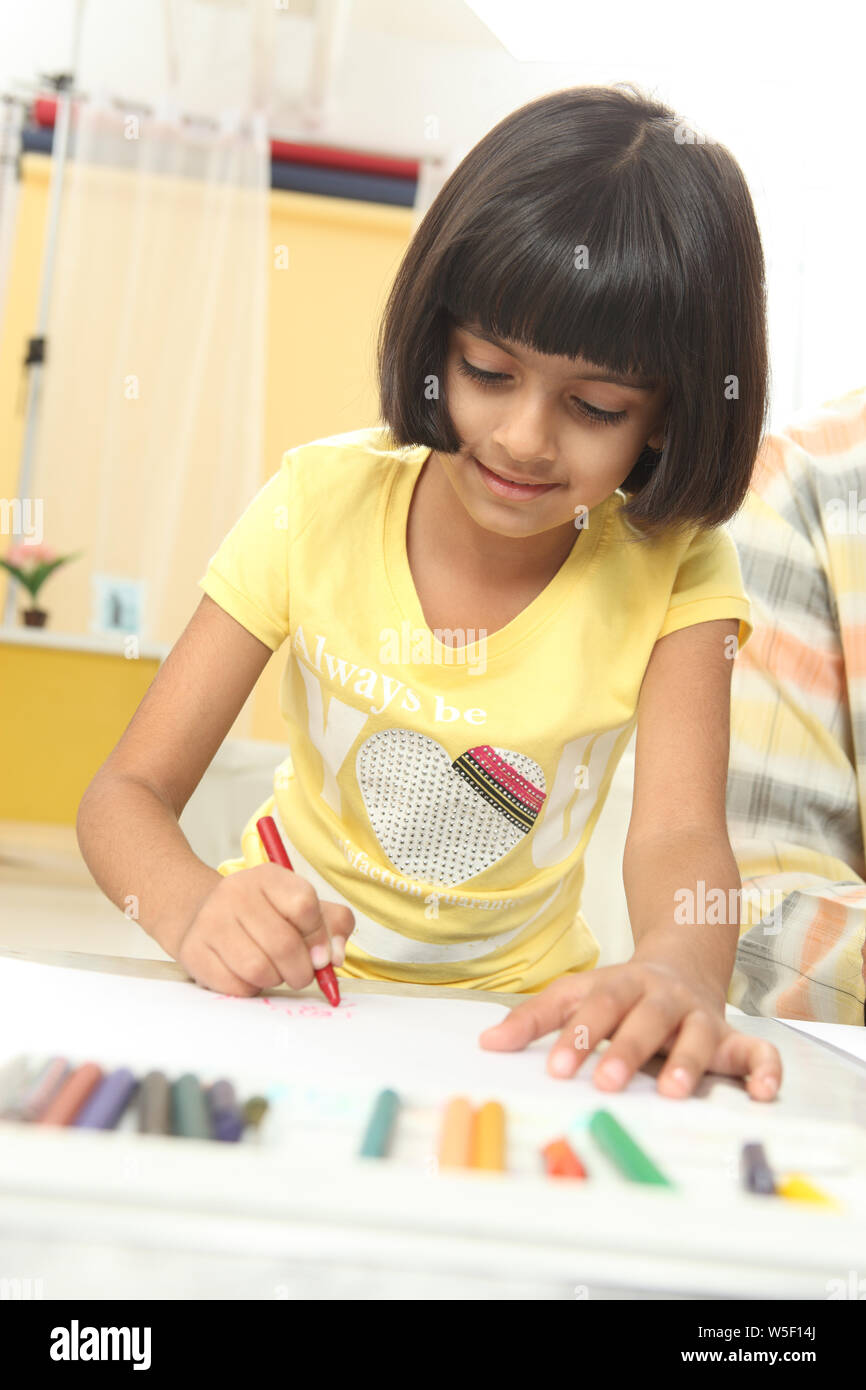 Girl looking colouring book hi-res stock photography and images - Alamy