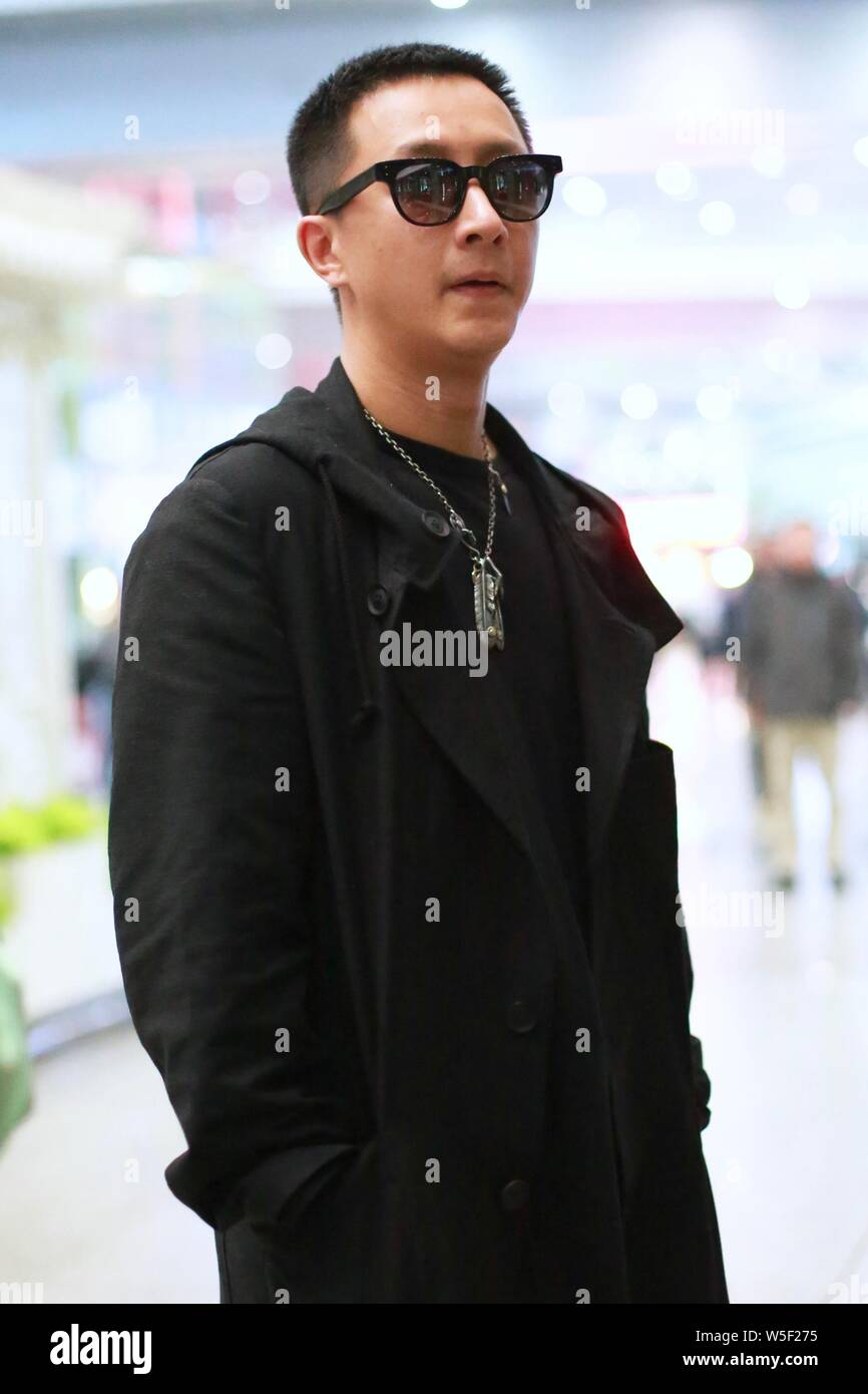 Chinese singer and actor Han Geng arrives at the Beijing Capital ...