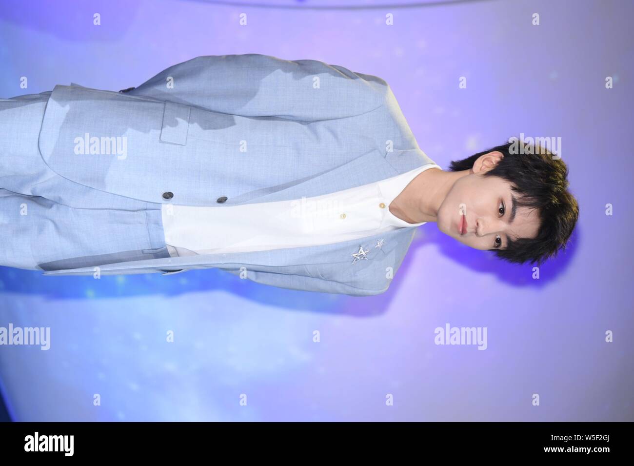 Karry Wang Jun Kai of Chinese boy group TFBoys attends a promotional ...