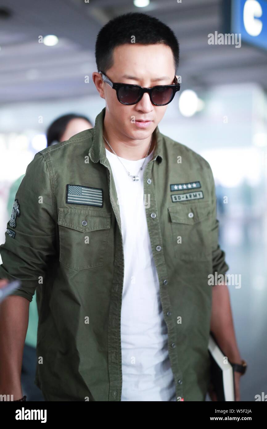 Chinese singer and actor Han Geng arrives at the Beijing Capital ...