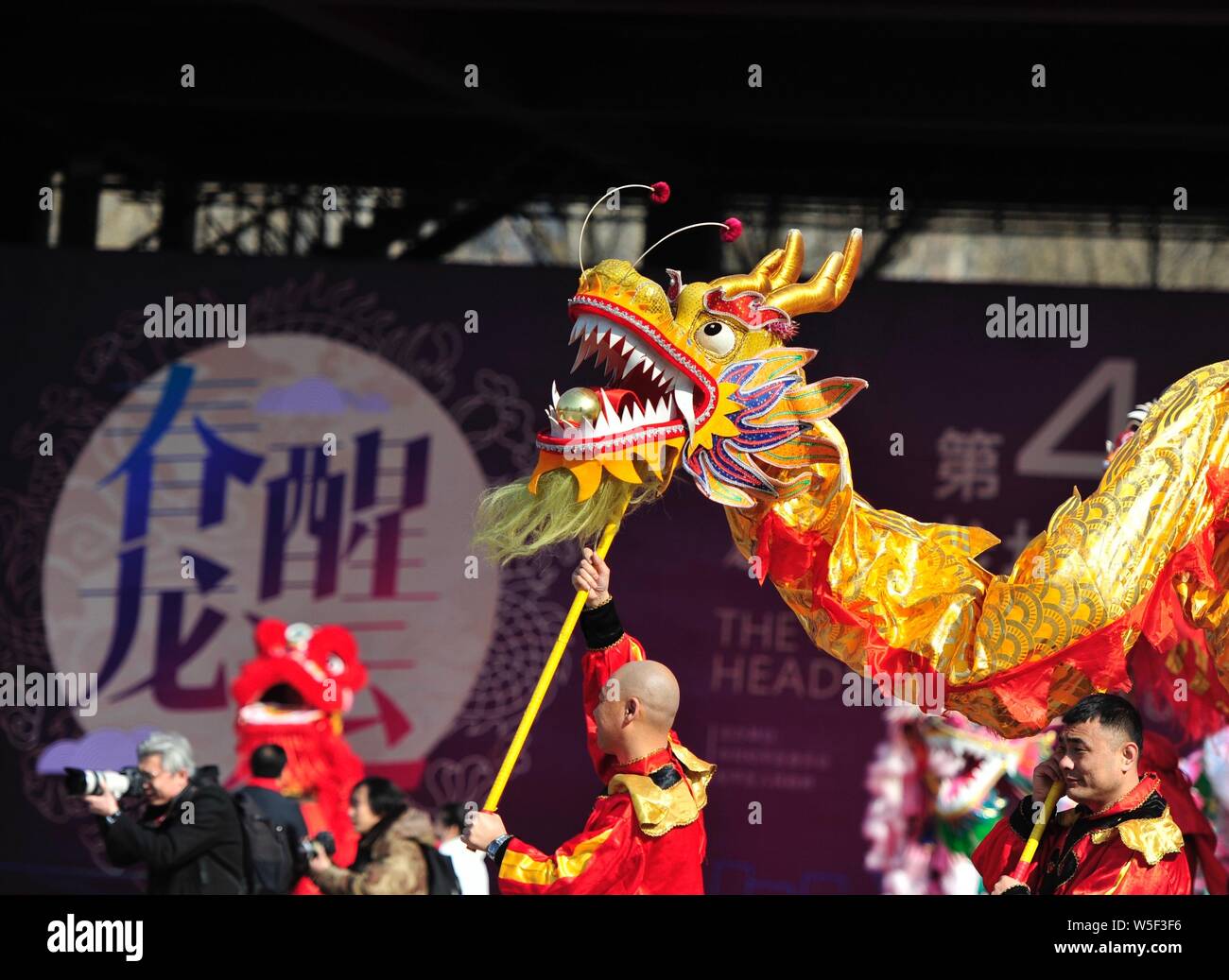 Chinese entertainers perform a dragon dance to celebrate the Dragon ...