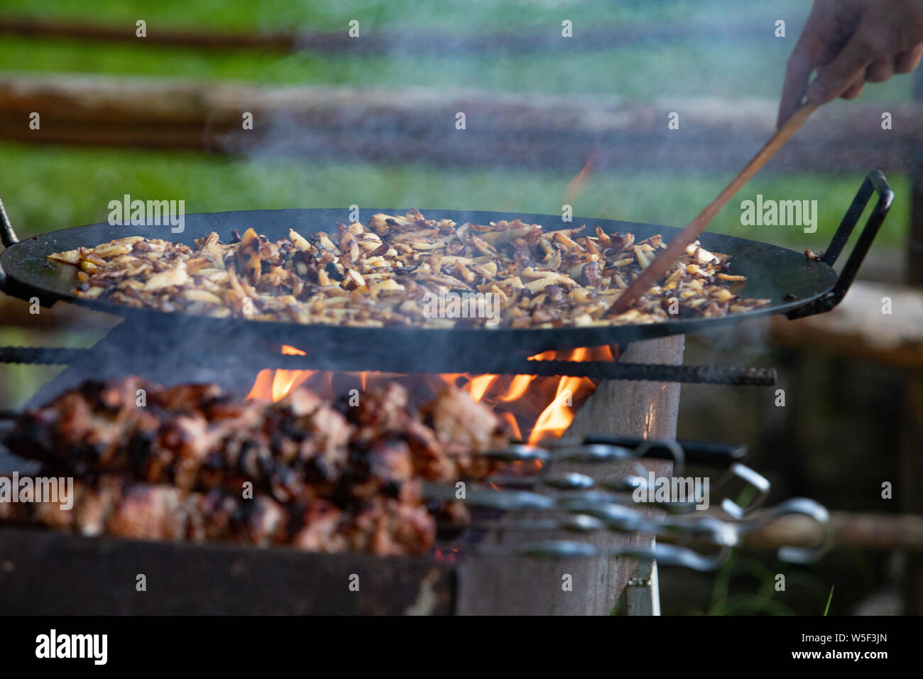 cooking meat at bbq fire close up Stock Photo - Alamy