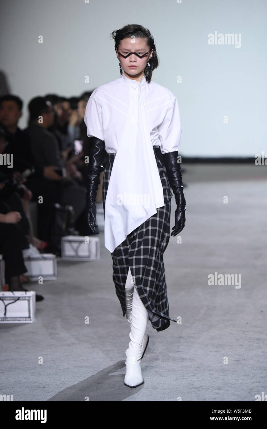 A model displays a new creation at the fashion show of Chris by ...