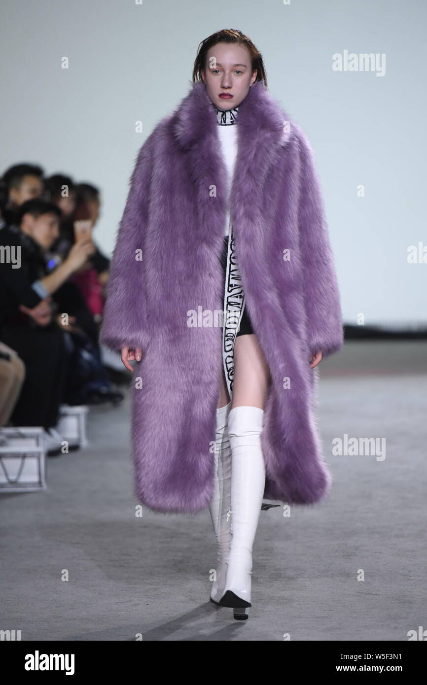 A model displays a new creation at the fashion show of Chris by ...